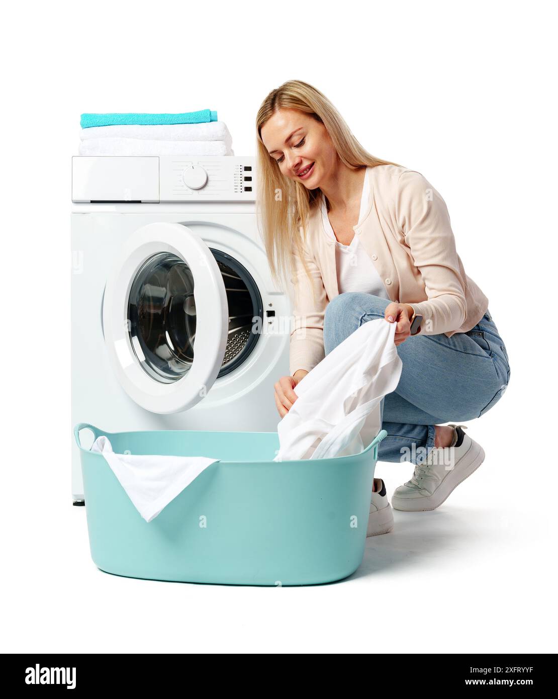 Woman Standing Next to a White Washing Machine With a Laundry Basket ...