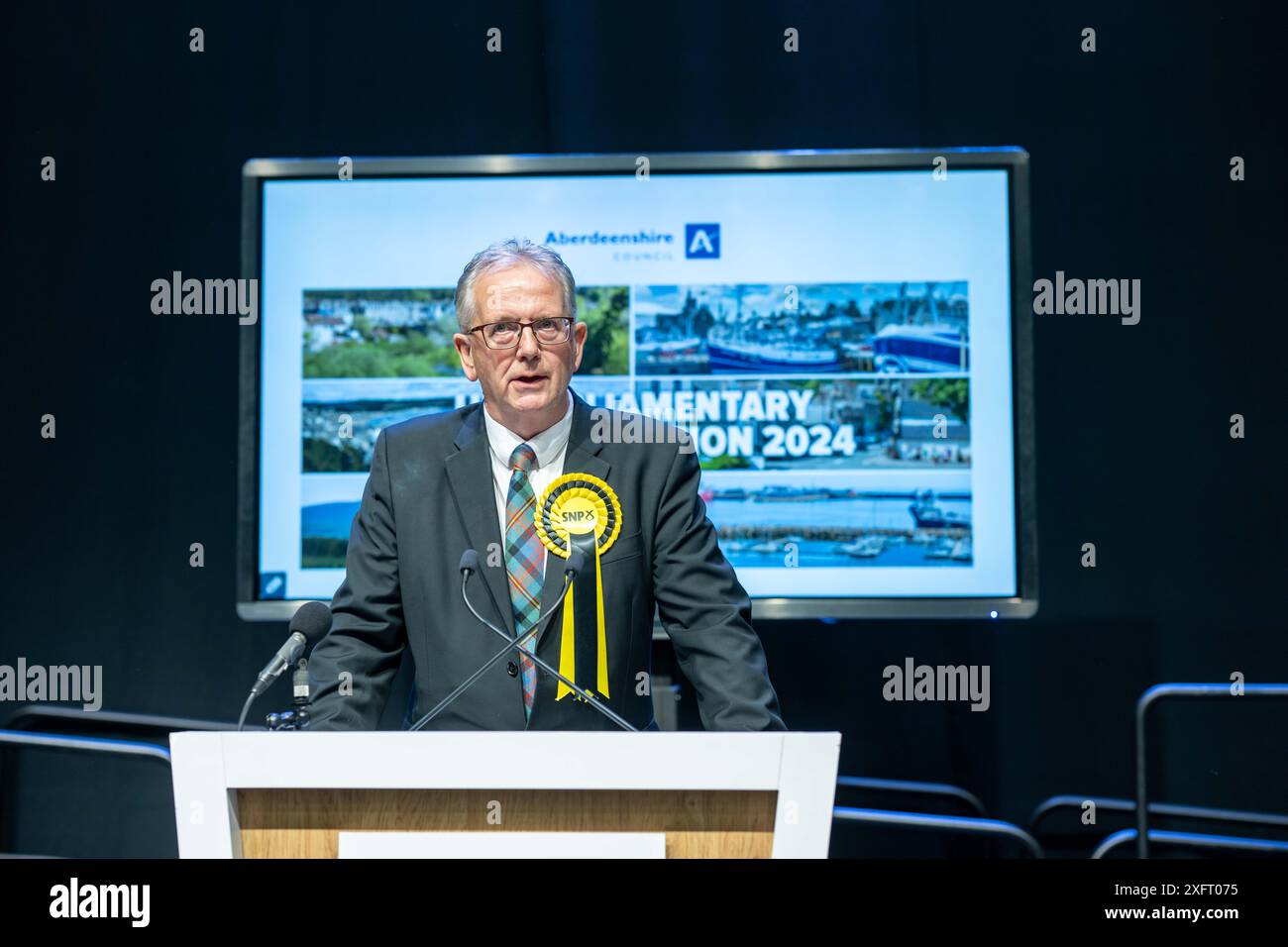 SNP's Seamus Logan, gives a speech after being declared the winner of ...