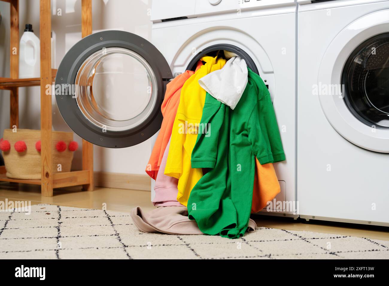 White Laundry Appliances With Colorful Clothes Overflowing From Washing ...