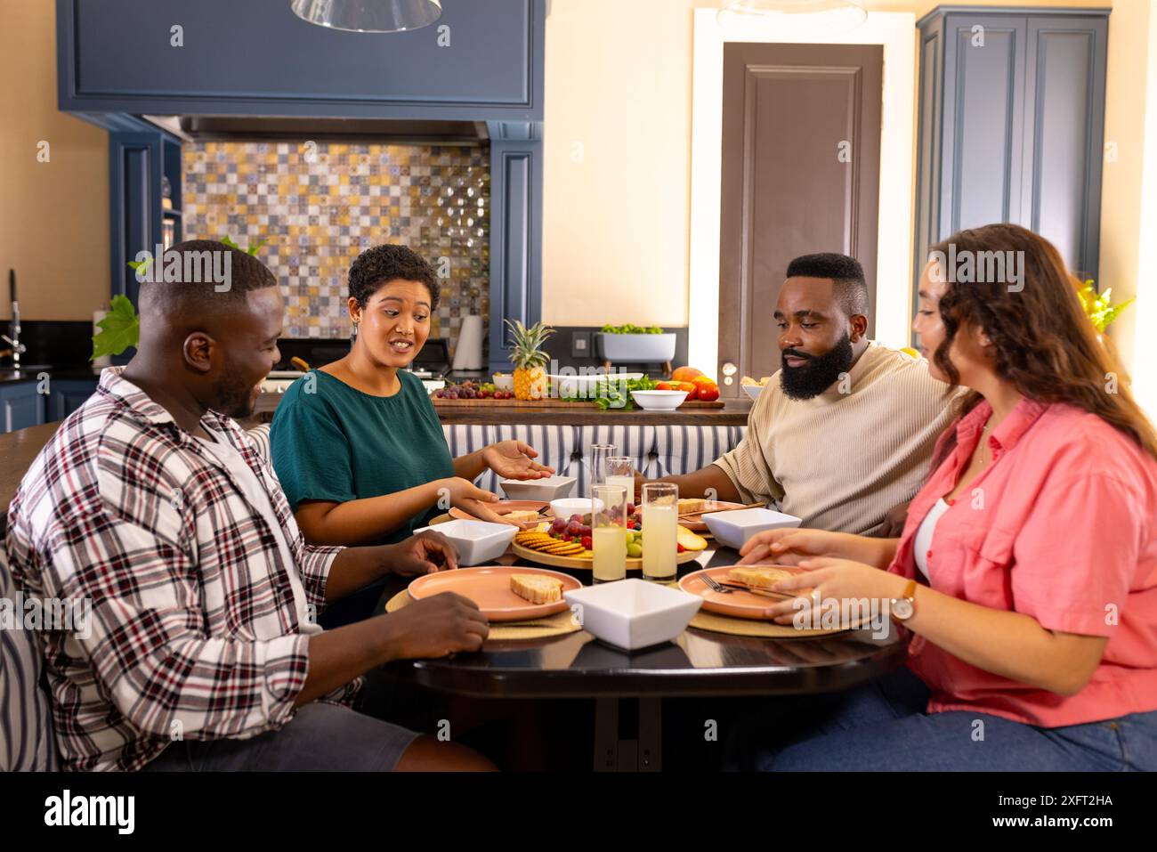 Group people meal around table hi-res stock photography and images - Alamy