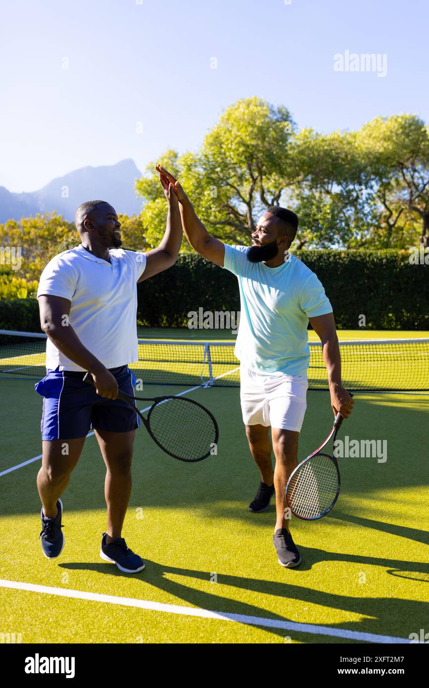 Diverse friends high fiving hi-res stock photography and images - Alamy