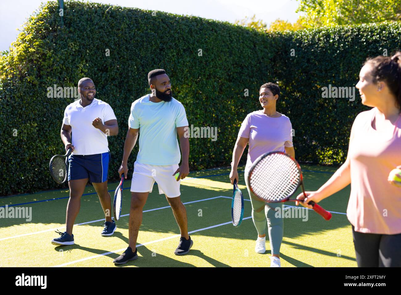 Diverse group of people playing sports hi-res stock photography and ...