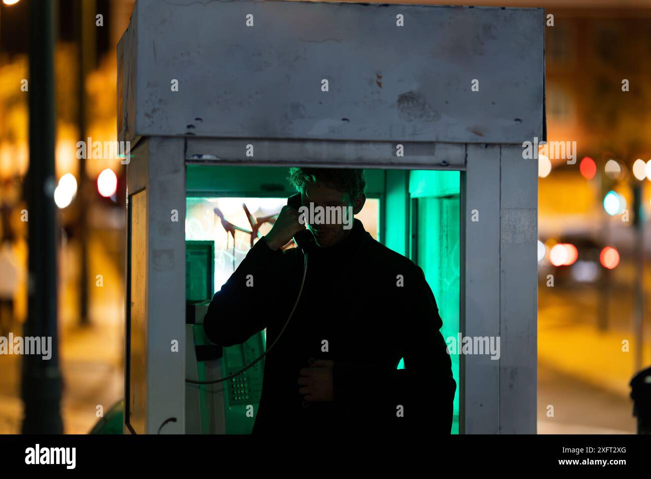 Phone booth night man hi-res stock photography and images - Alamy