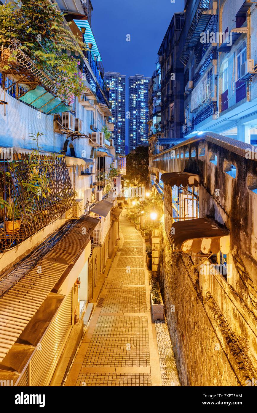 Wonderful night view of narrow street at old town of Macau. Modern high ...