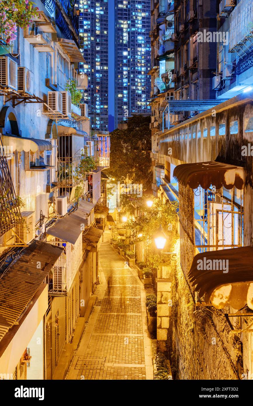 Wonderful night view of narrow street at old town of Macau. Modern high ...