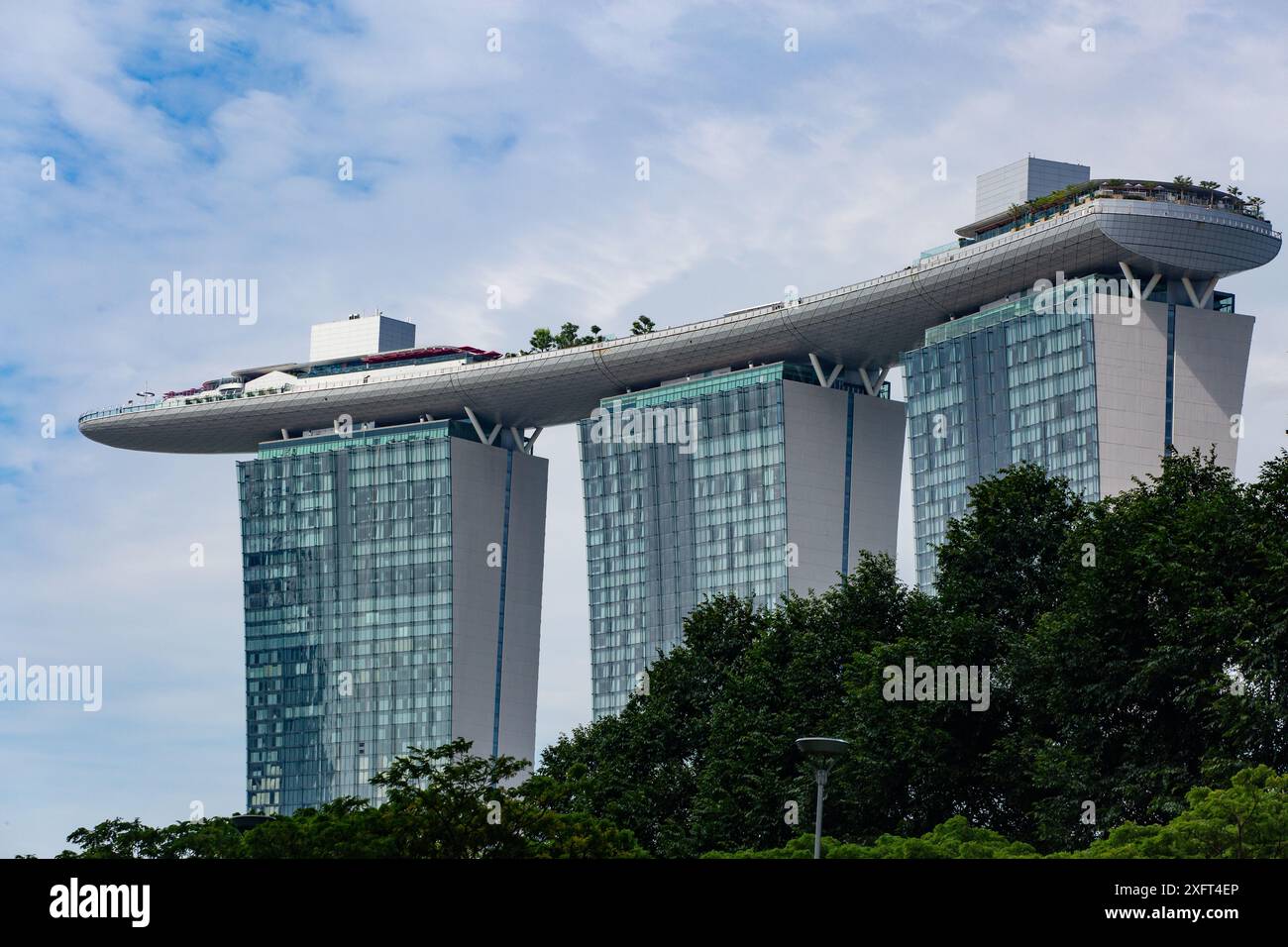 Marina Bay Sands architecture and greenery trees in the bottom of frame ...