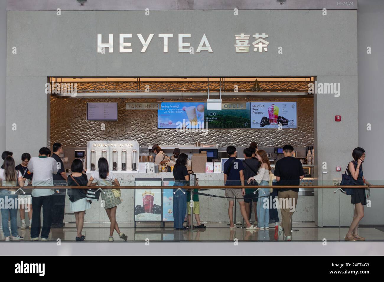 China tea brand Heytea outlet at Marina Bay Sands, popular tea drinks. High foot traffic can be ...