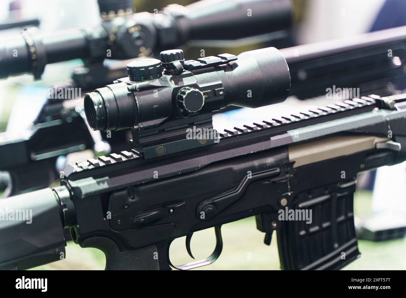 Modern weapons automatic rifles and machine gun on the counter ...