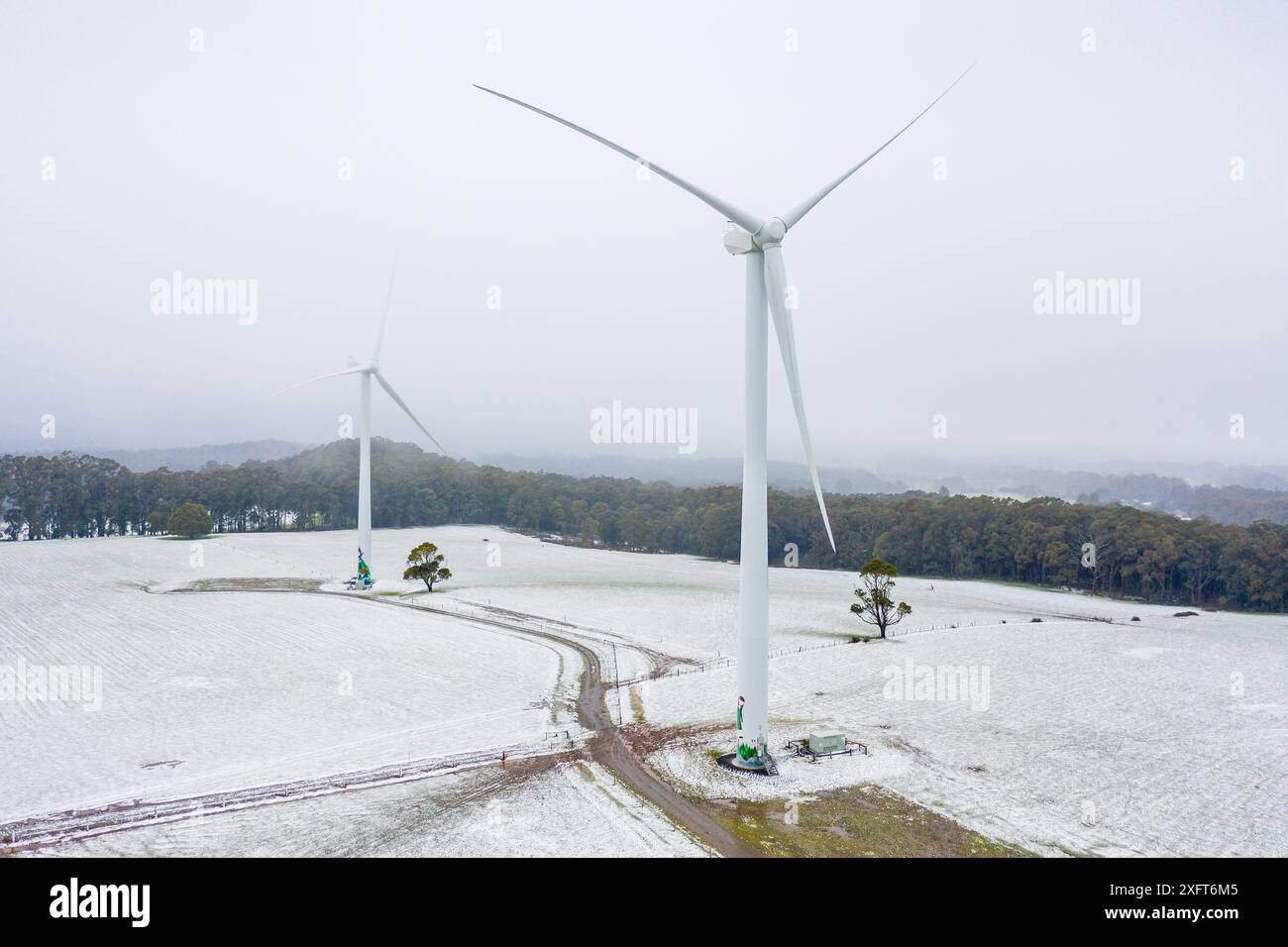 Aerial view of wind turbines ona snow covered hill top at Leonards Hill ...