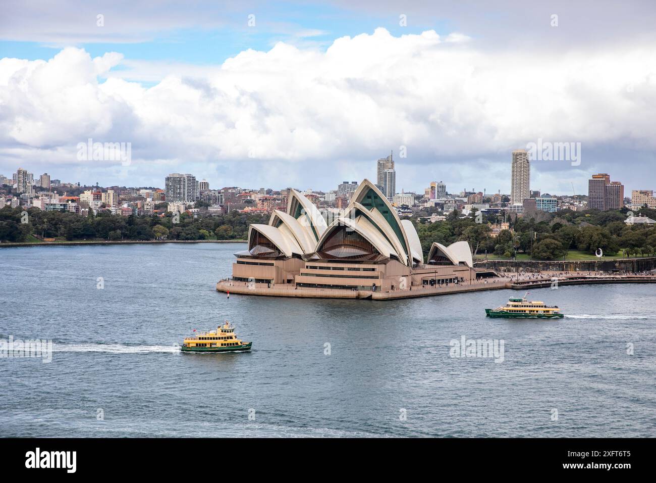 Sydney ferries and the Sydney Opera House building, with tower blocks ...