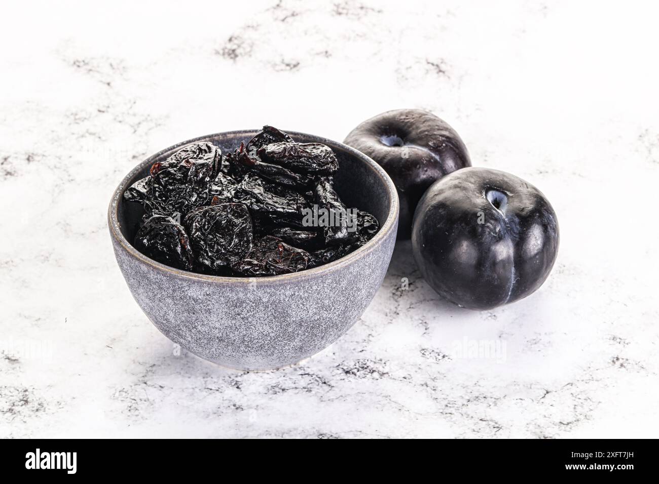 Dry sweet prunes in thw bowl Stock Photo - Alamy