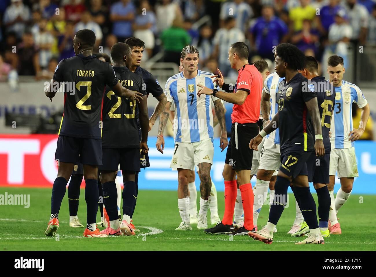 Argentina's midfielder Rodrigo de Paul (C) chats with Uruguayan referee ...