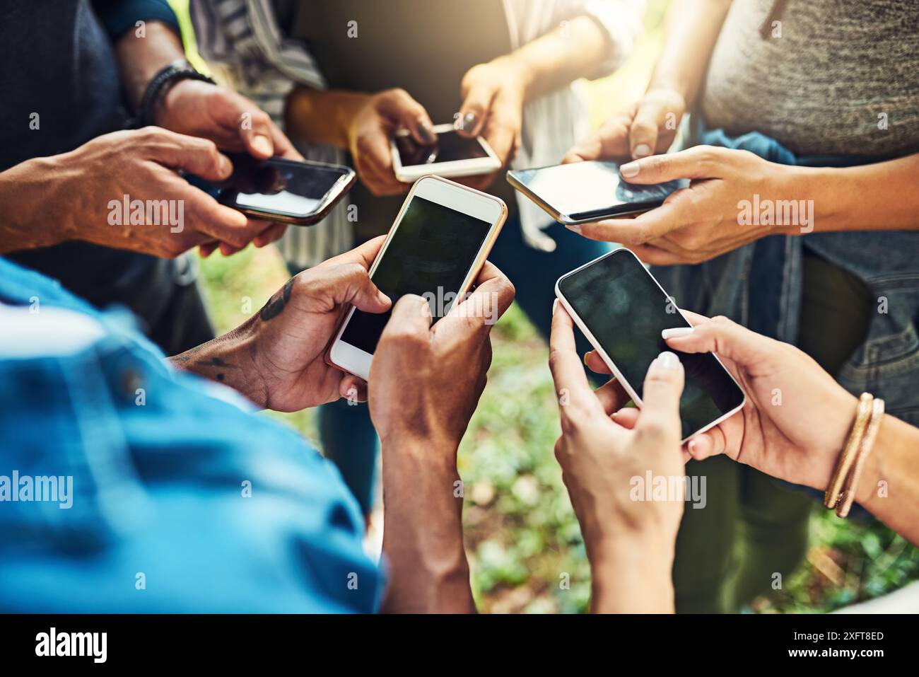 Hands, phone and networking with people, huddle and communication or ...