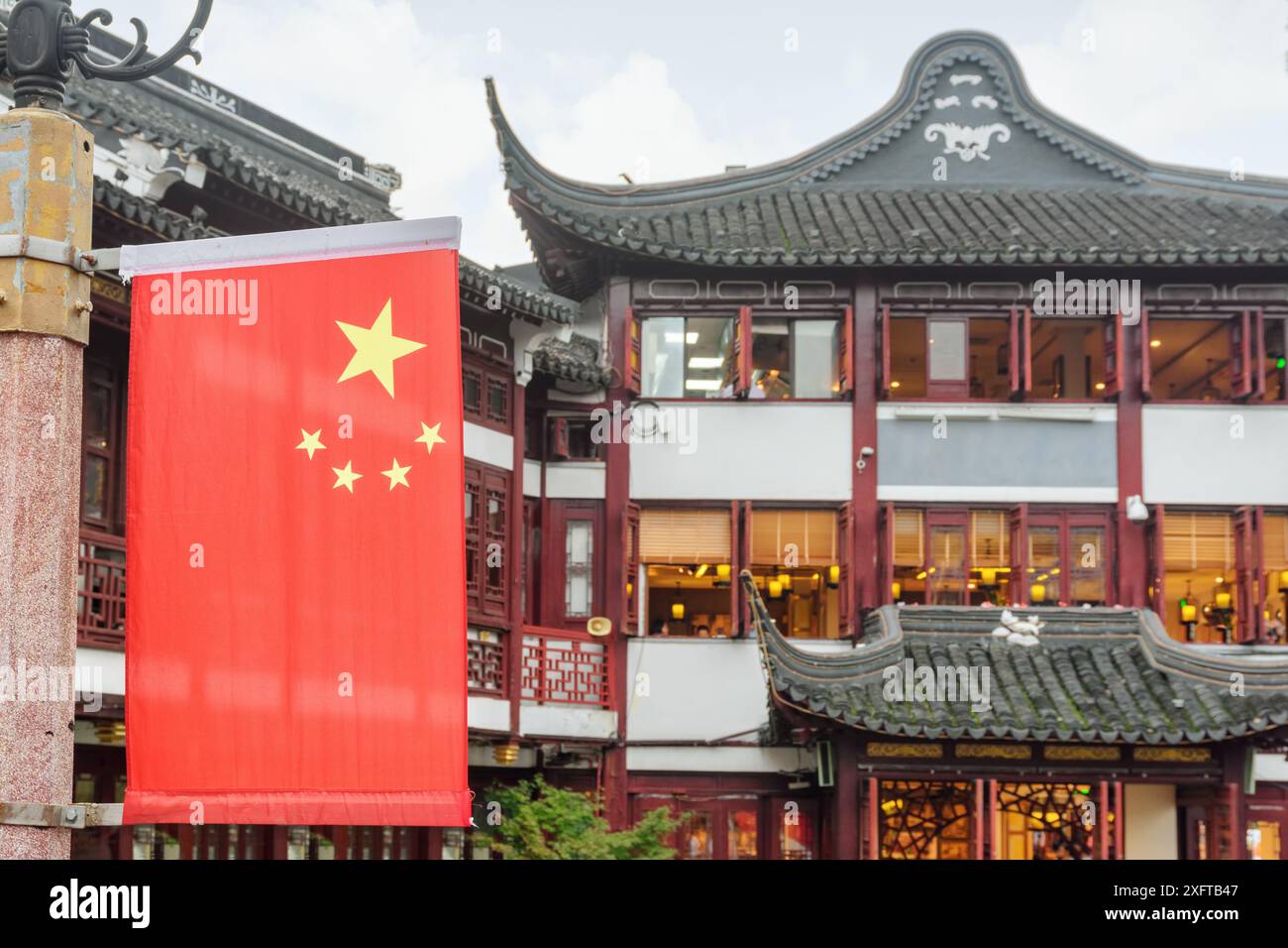 The Flag of China on street at the Old City of Shanghai. Scenic ...