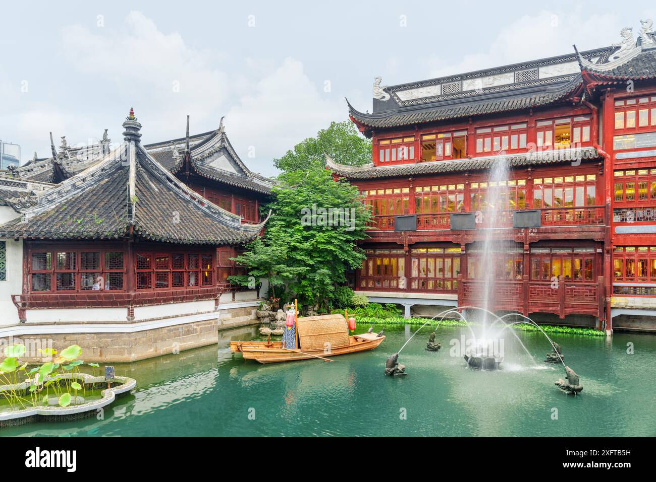 Amazing view of fountain in middle of scenic pond among traditional ...