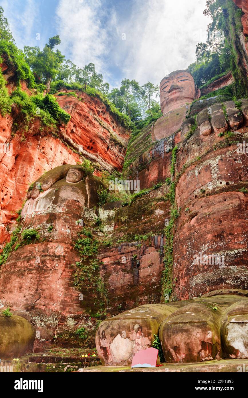 The Leshan Giant Buddha on blue sky background. Bottom view on sunny ...