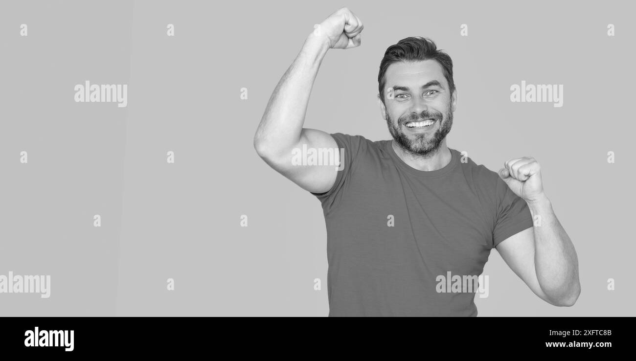 The winner. Successful man raising arms. Excited man with arms up ...