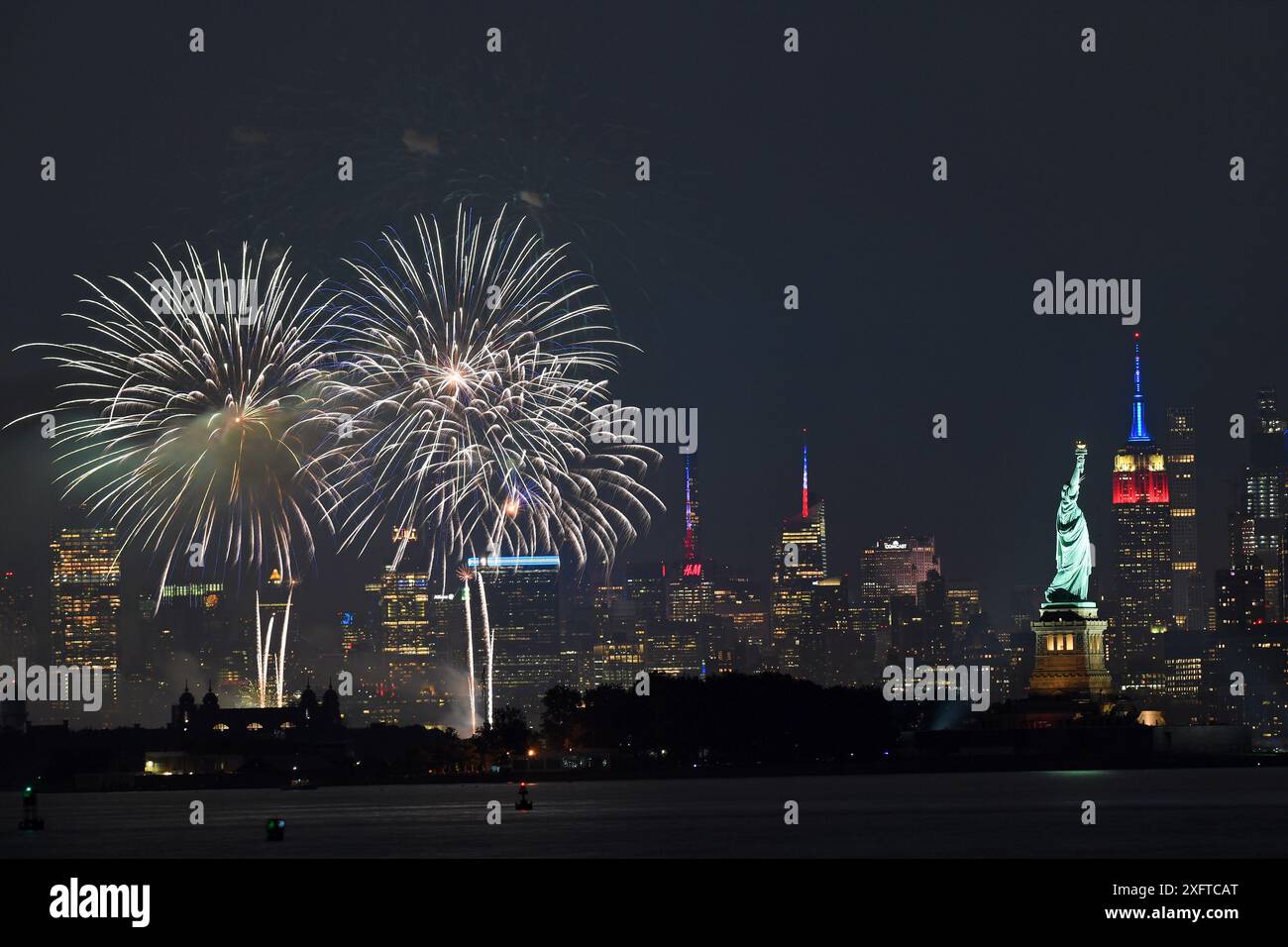 New York, USA. 4th July, 2024. Fireworks explode over the Hudson River ...