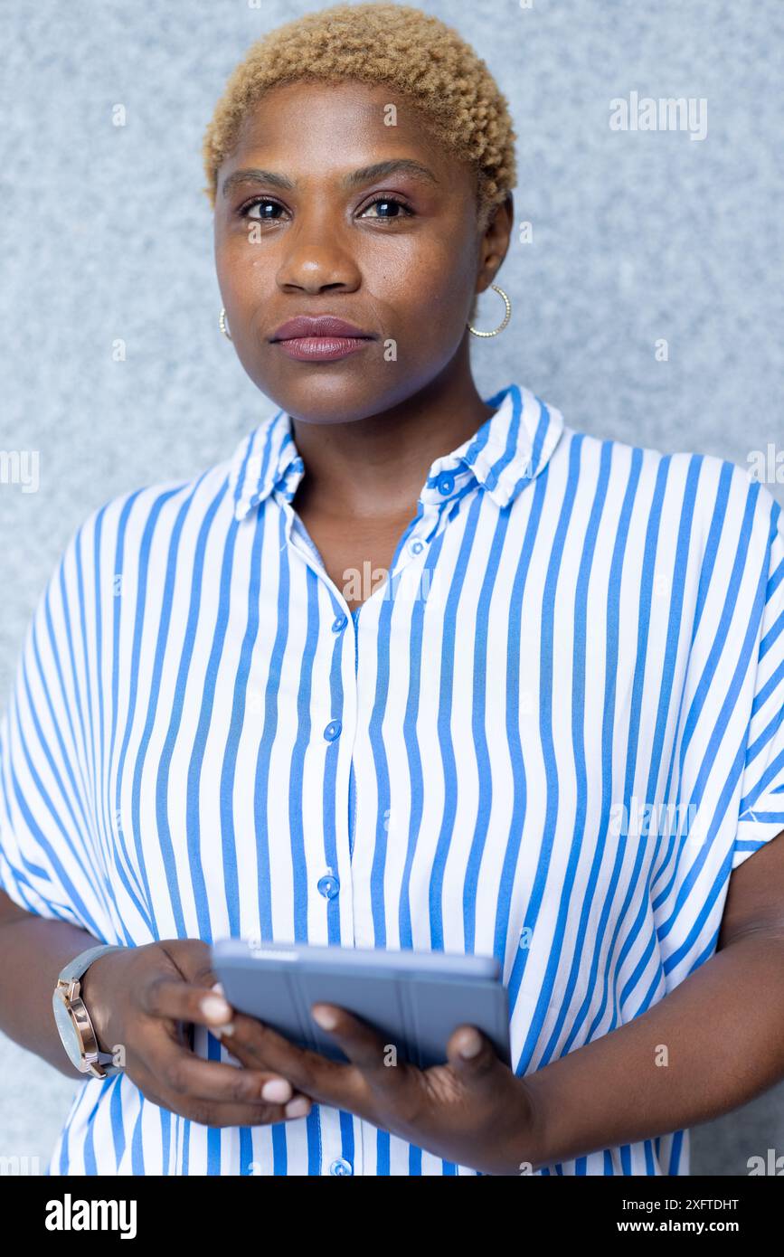 Focused woman in striped shirt hi-res stock photography and images - Alamy