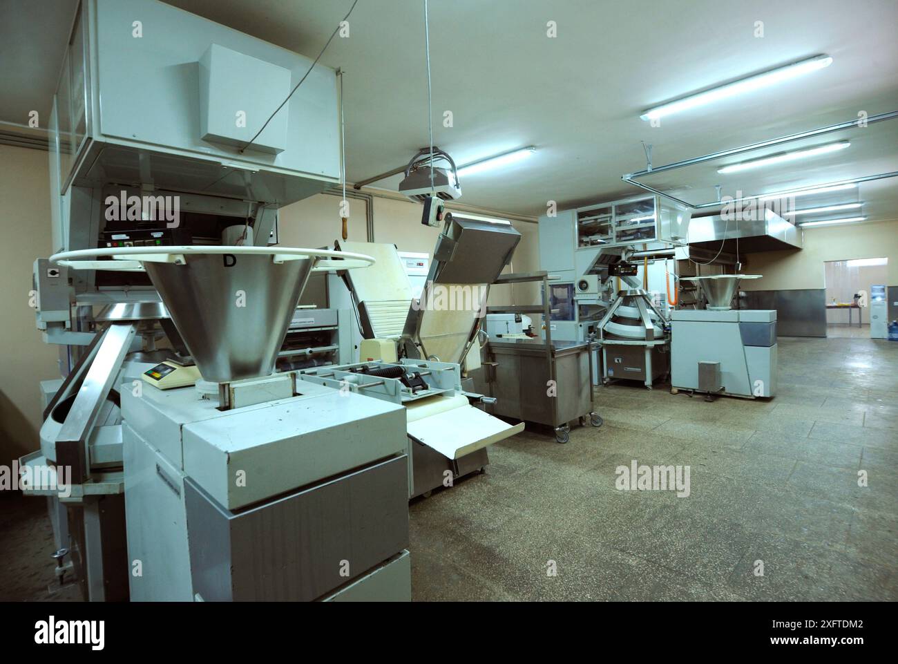 An automatic production dough line prepared for work at the bakery ...