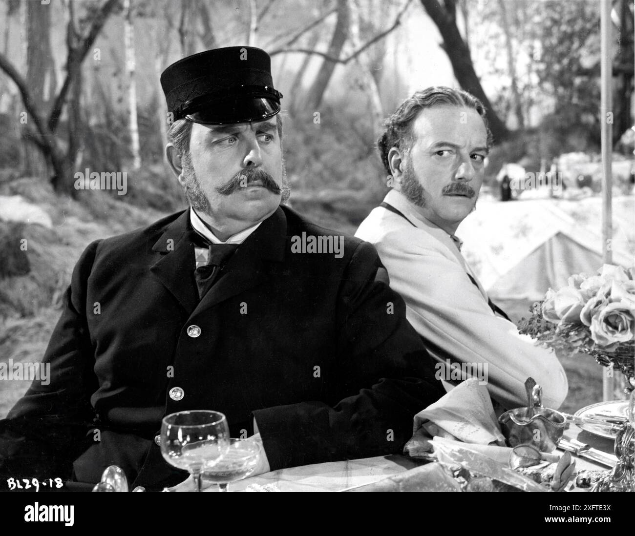 ROBERT MORLEY as librettist W.S. Gilbert and MAURICE EVANS as composer ...