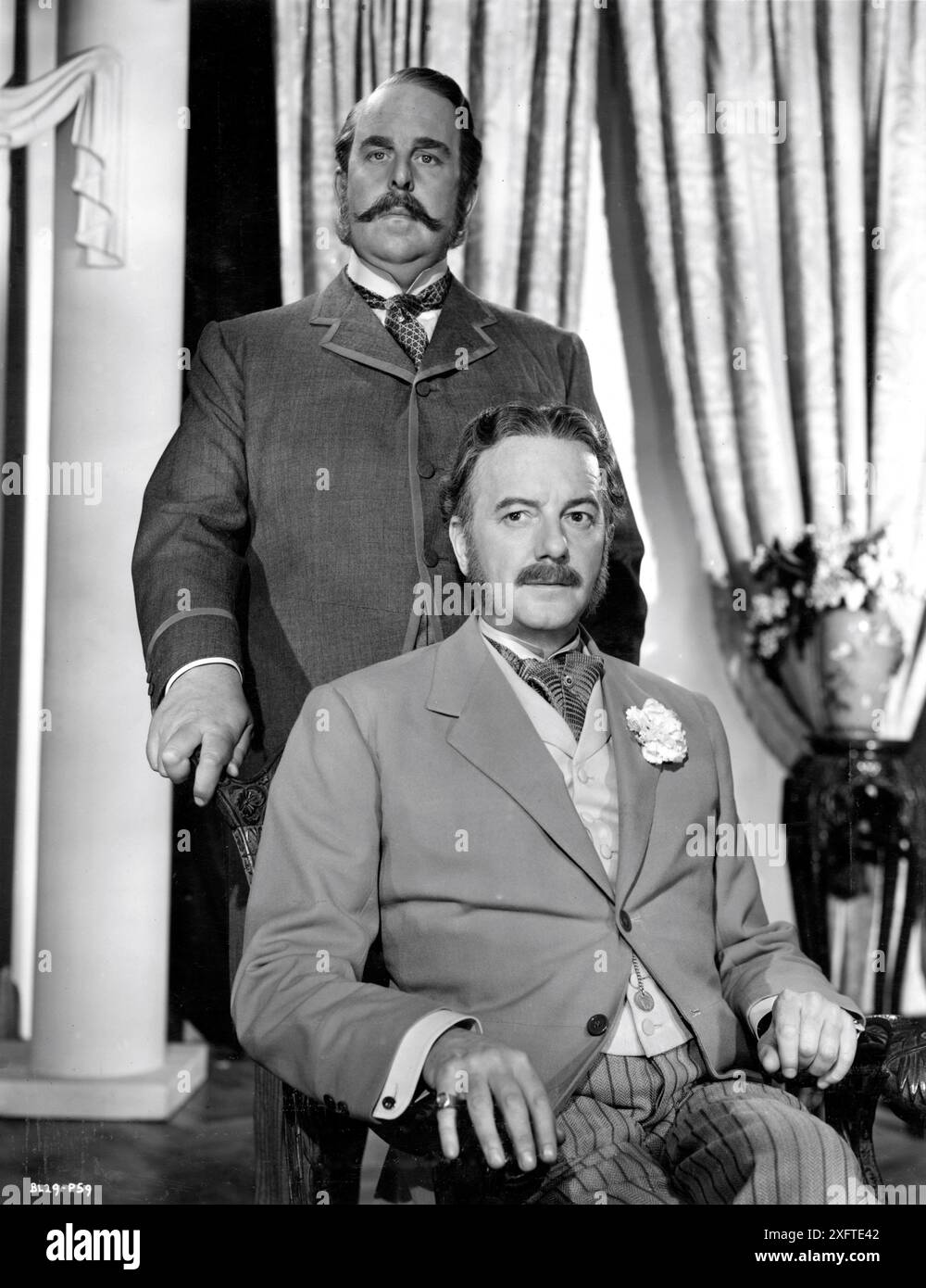 ROBERT MORLEY as librettist W.S. Gilbert and MAURICE EVANS as composer ...