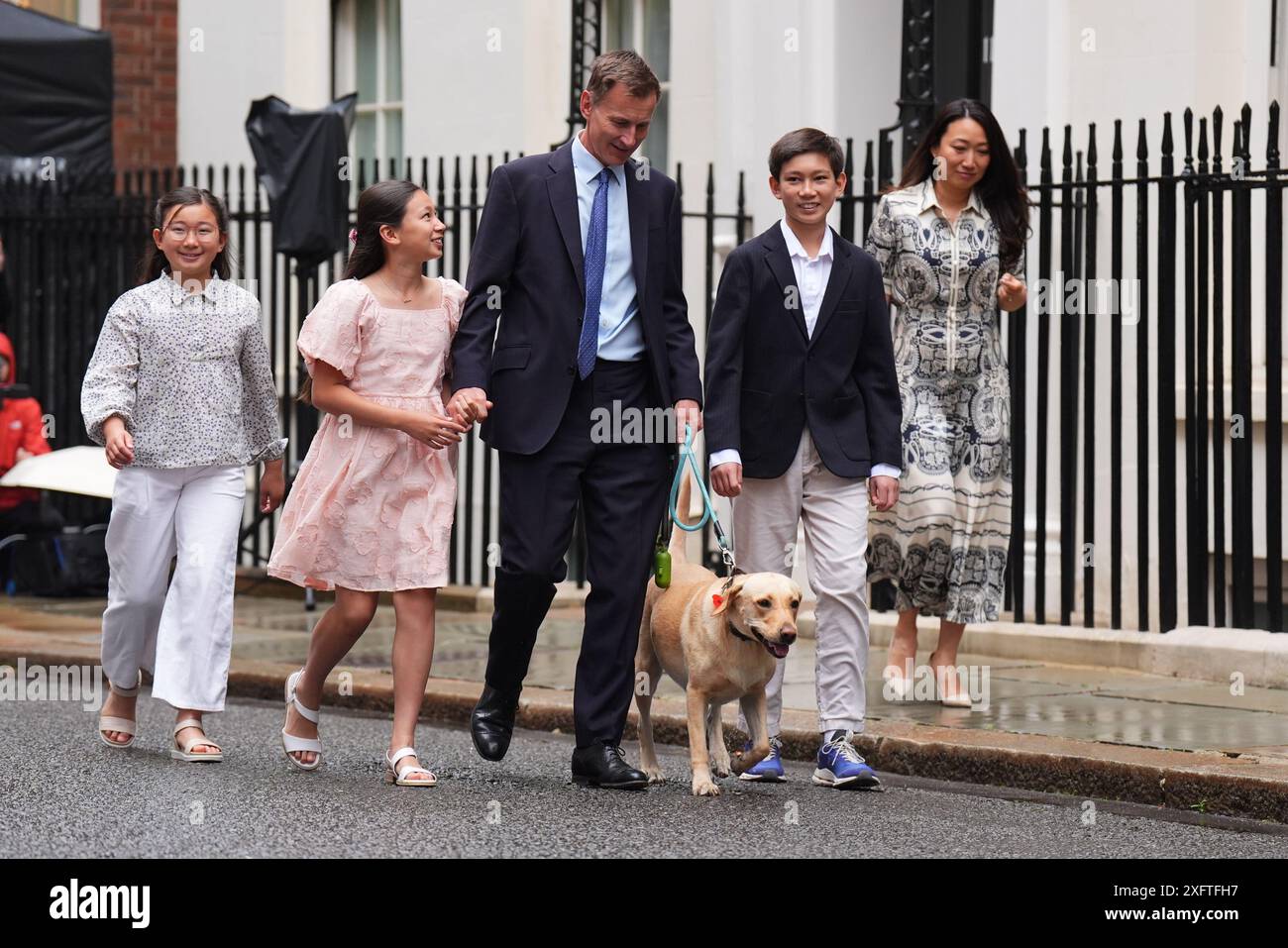 Outgoing Conservative chancellor of the exchequer Jeremy Hunt, with his ...