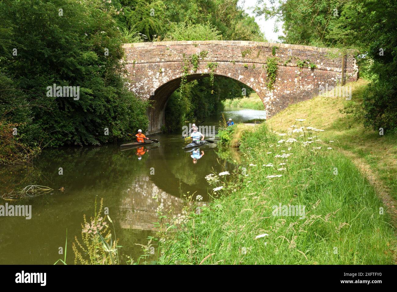Canoeing on the Kennet and Avon canal going under a arch bridge in ...