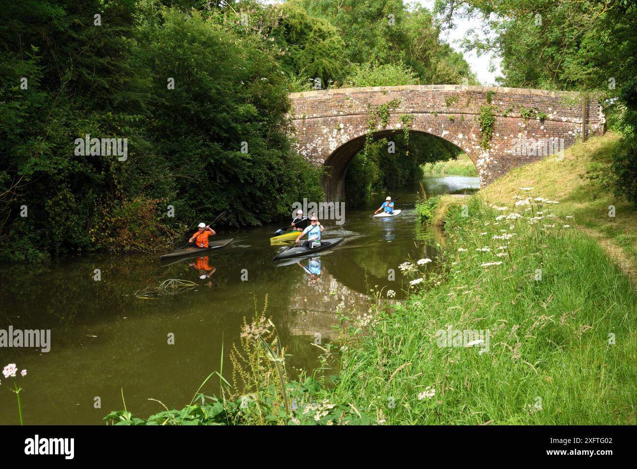 Canoeing on the Kennet and Avon canal going under a arch bridge in ...
