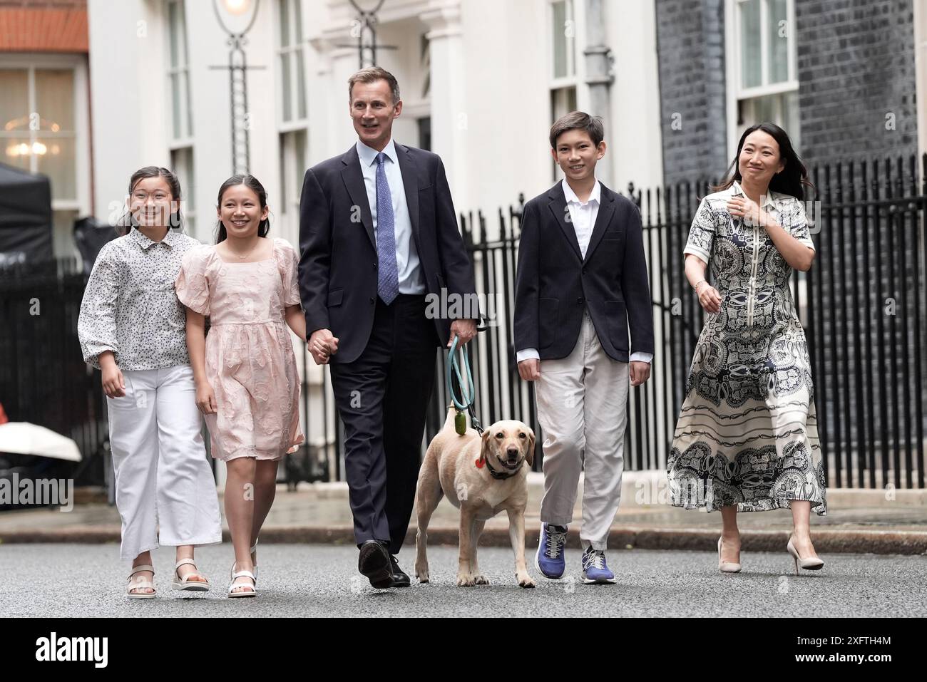 Outgoing Conservative chancellor of the exchequer Jeremy Hunt, with his ...