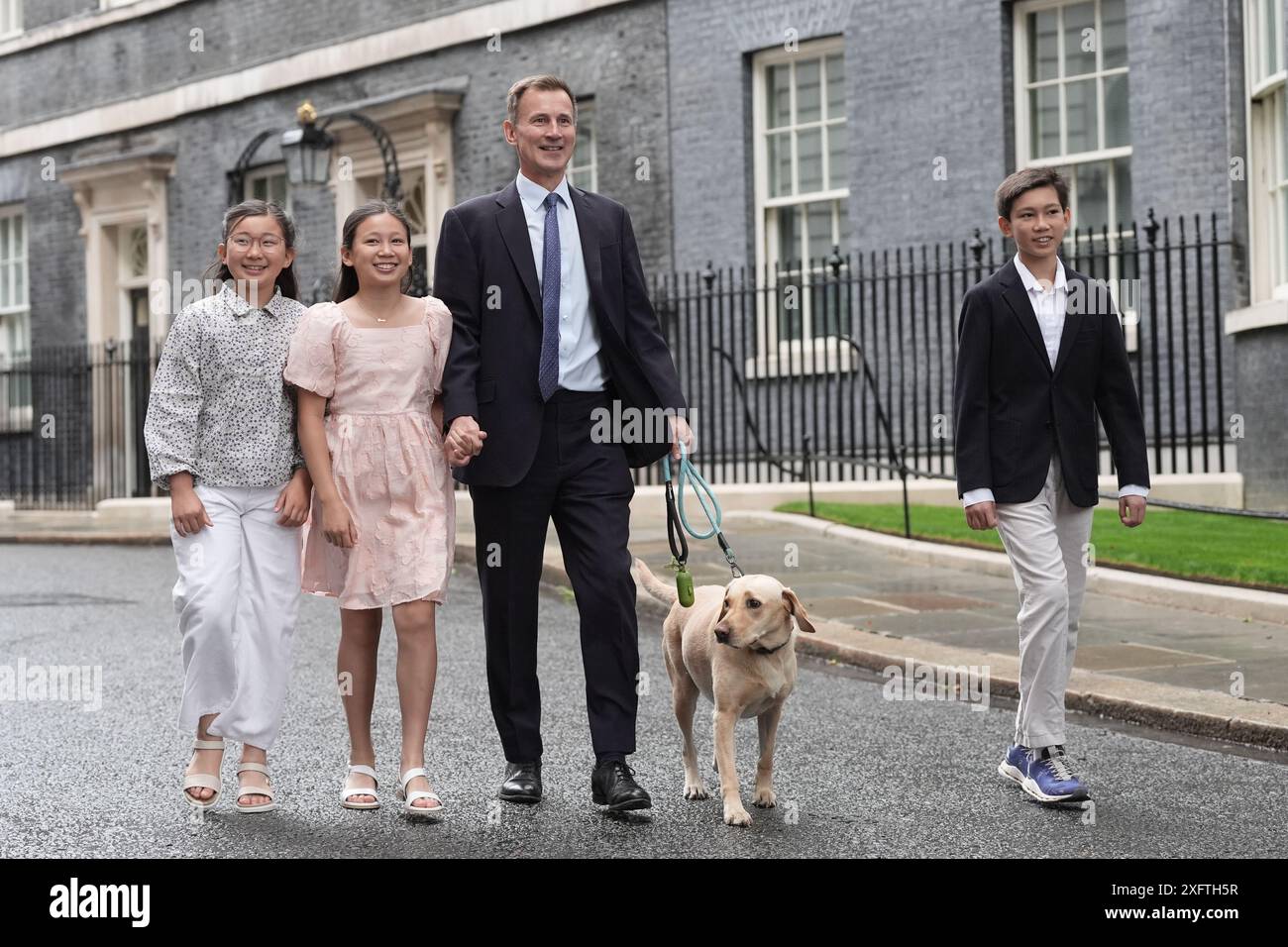 Outgoing Conservative chancellor of the exchequer Jeremy Hunt, with his ...