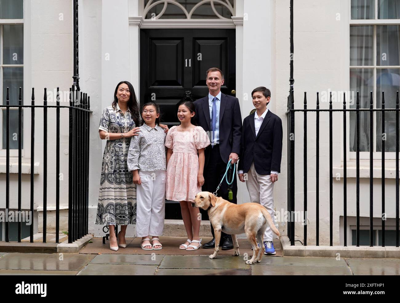 Outgoing Conservative chancellor of the exchequer Jeremy Hunt, with his ...
