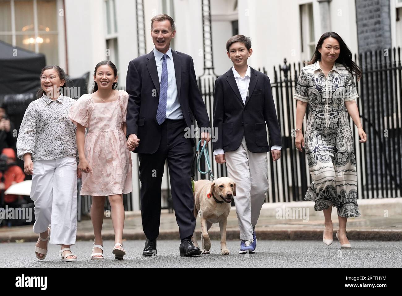Outgoing Conservative chancellor of the exchequer Jeremy Hunt, with his ...
