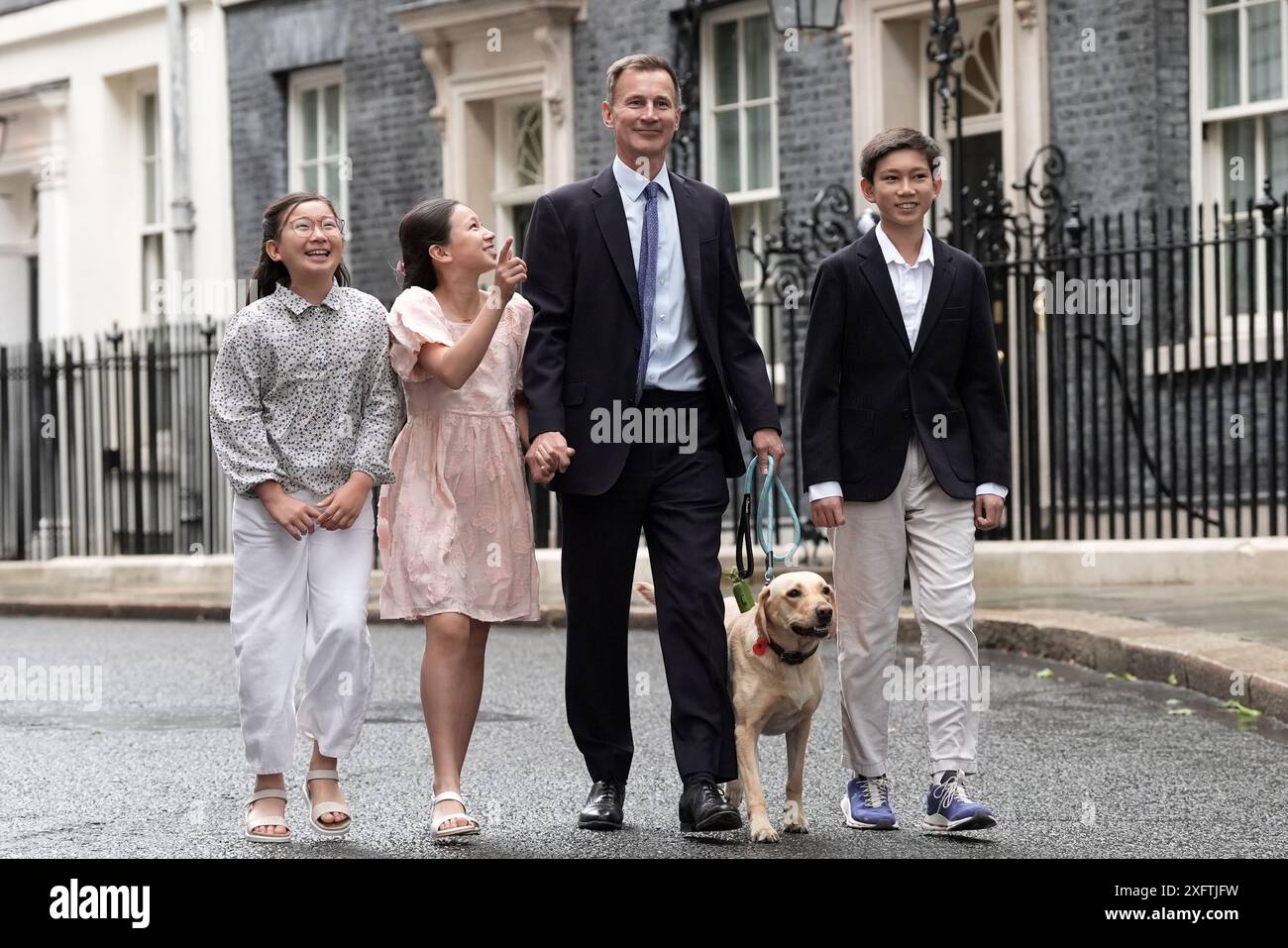 Outgoing Conservative chancellor of the exchequer Jeremy Hunt, with his ...