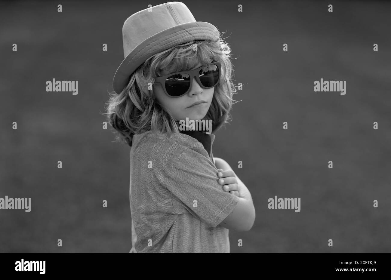 Funny sad emotions. Outdoor close up portrait of a cute little child ...