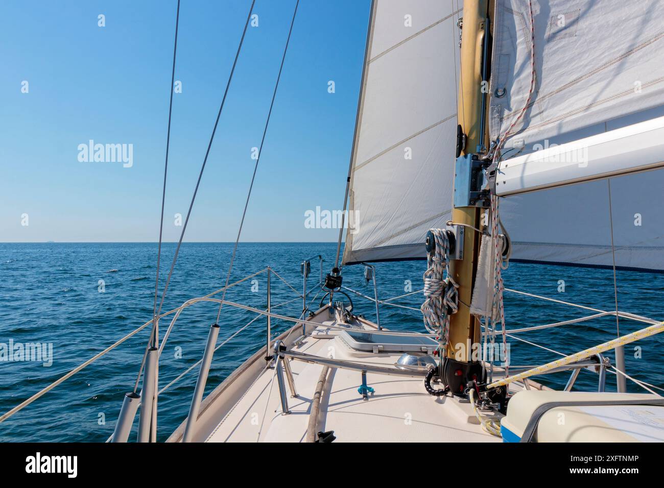 Luxury cruise on a sailing rigged yacht under a genoa and mainsail ...