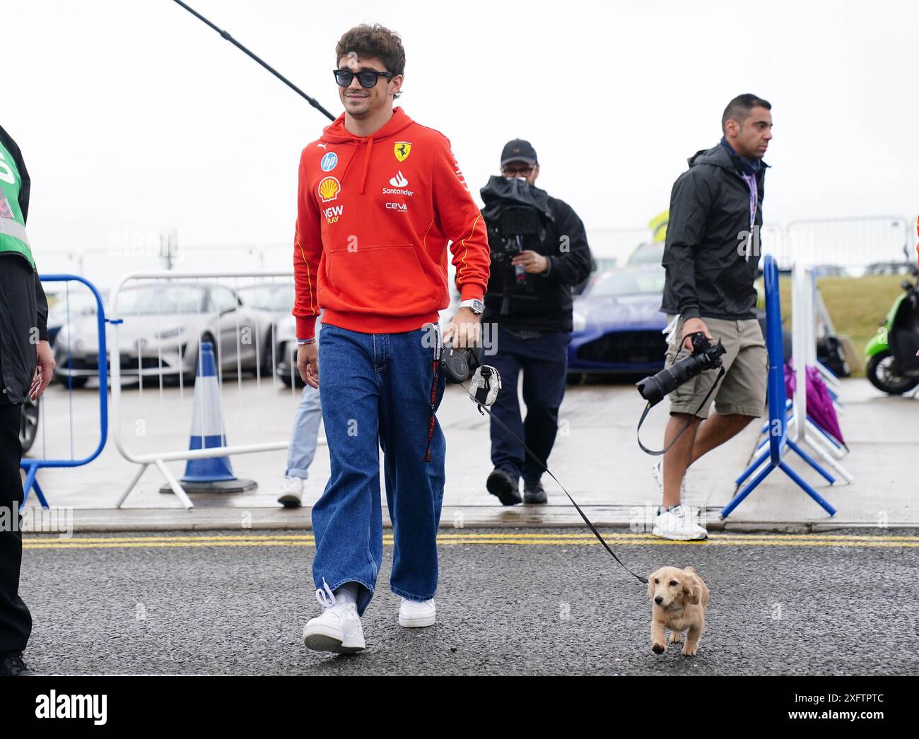 Ferrari's Charles Leclerc and his dog 'Leo' arrive on practice day at ...