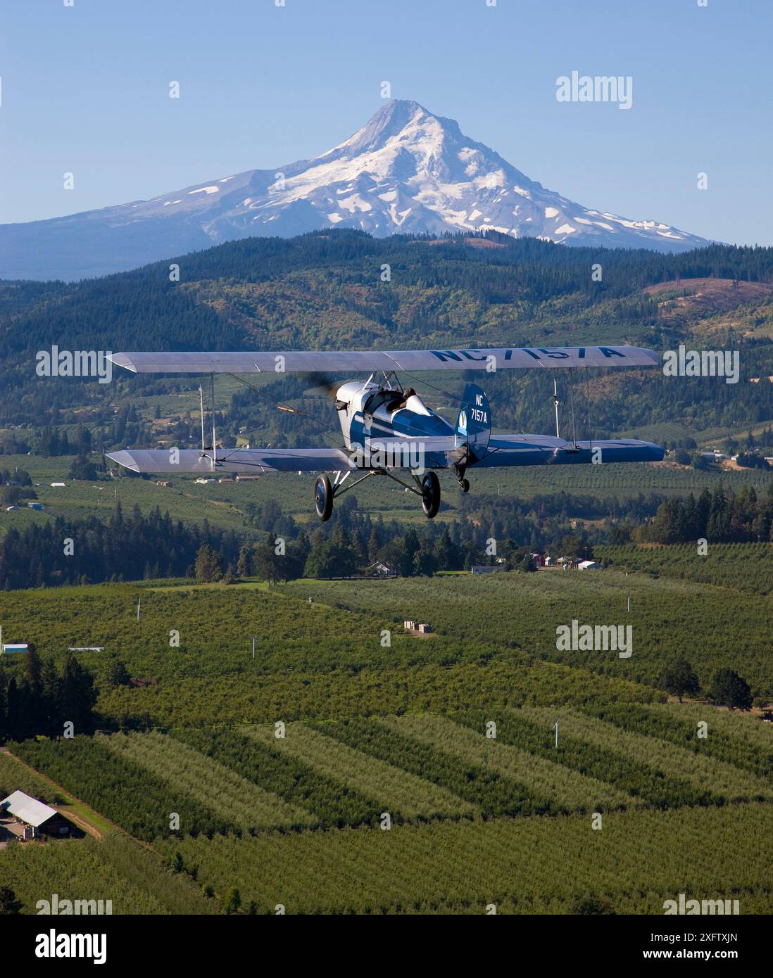 Antique plane flies over Hood River Valley, Oregon Stock Photo - Alamy