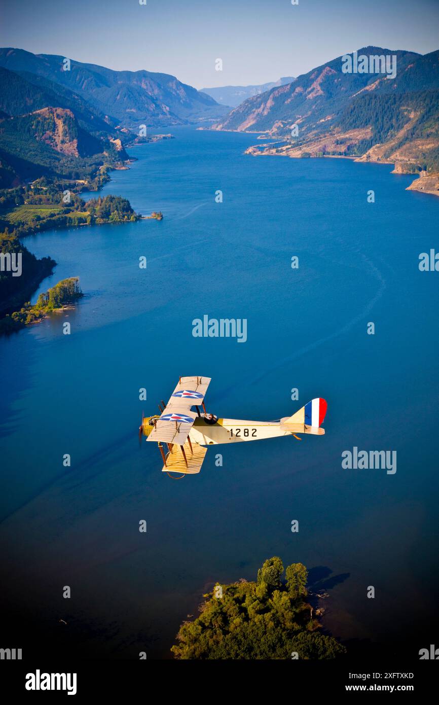 Antique plane flies over the Columbia River Gorge Hood River, Oregon ...
