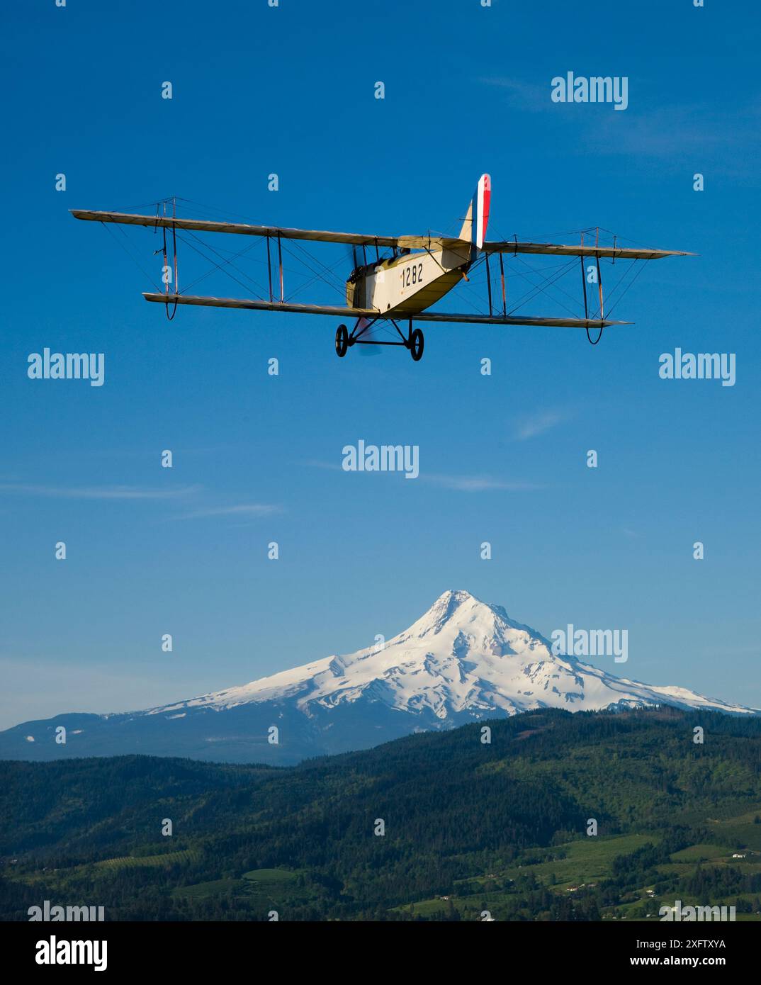 Curtiss Jenny flying towards Mt. Hood over Hood River Valley, Oregon ...