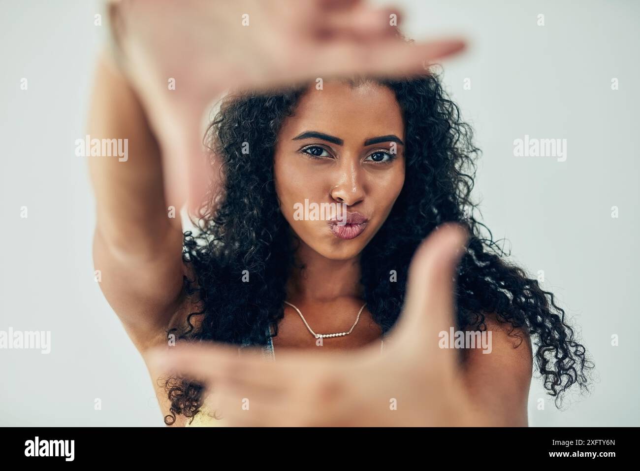 Woman, portrait and hands with pout in frame for selfie, picture or ...