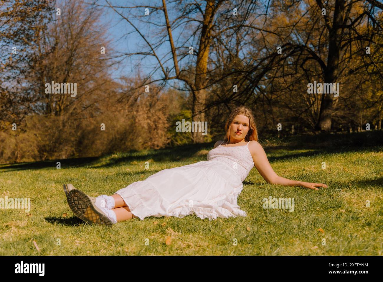 Woman reclining on grass hi-res stock photography and images - Alamy