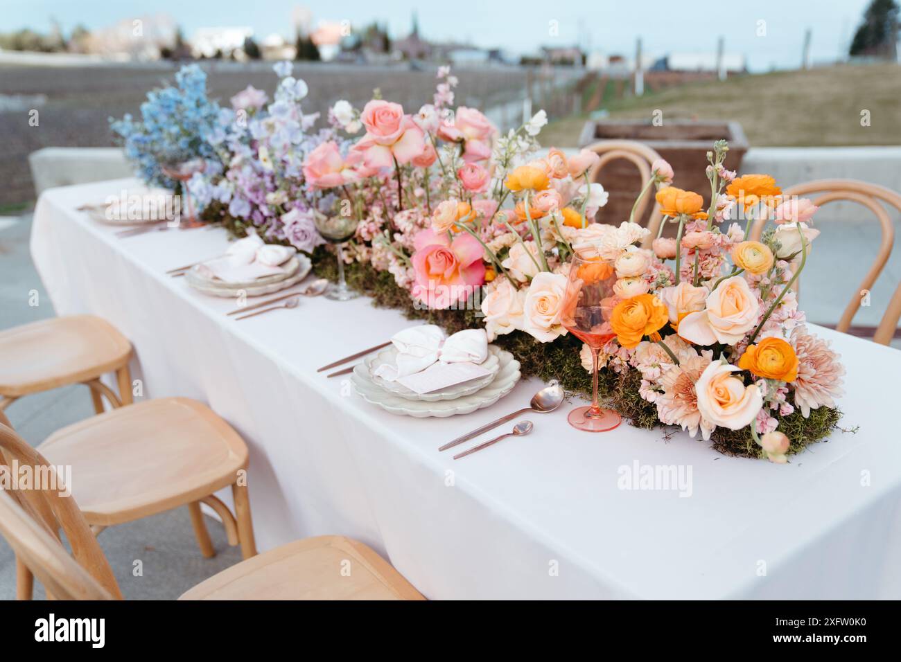 Wedding table with vibrant floral arrangements Stock Photo - Alamy