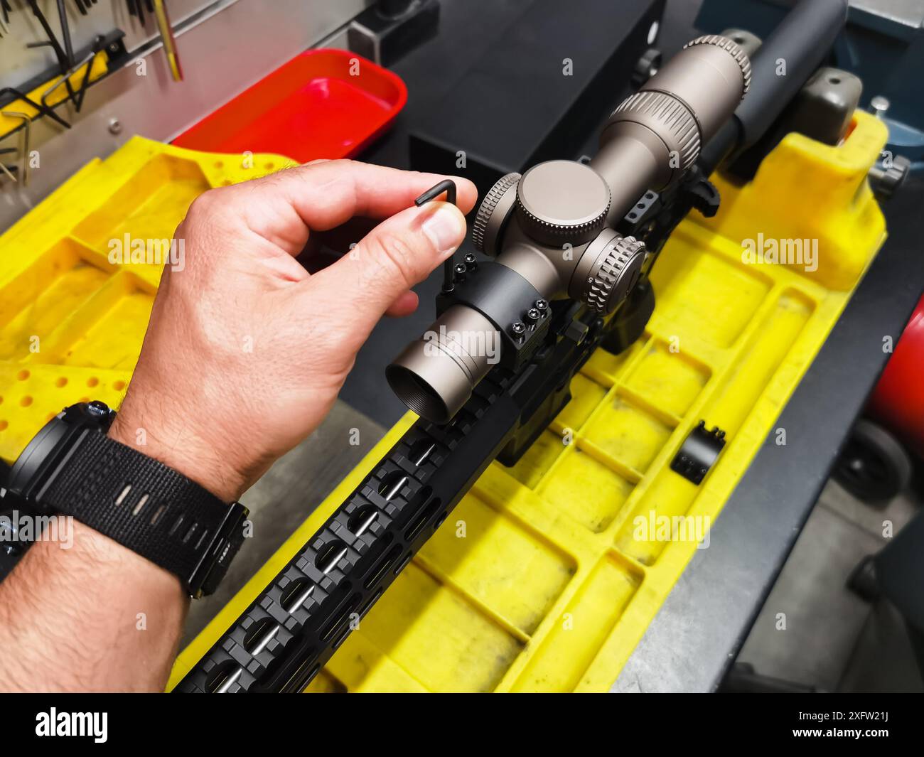 Installing an optical sight on a rifle in a workshop Stock Photo - Alamy