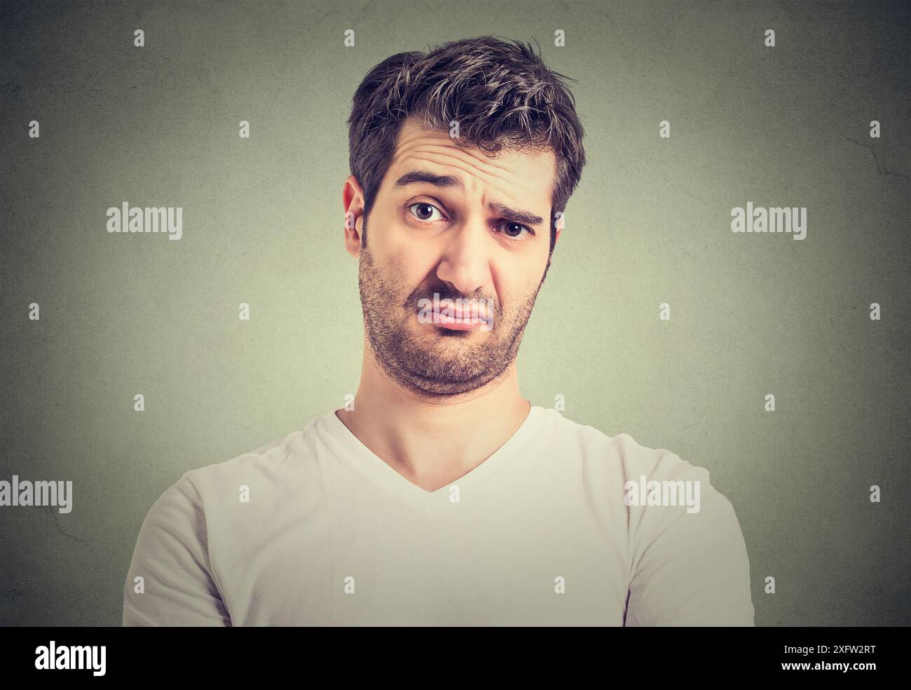 portrait of skeptical man looking suspicious, some disgust on his face ...