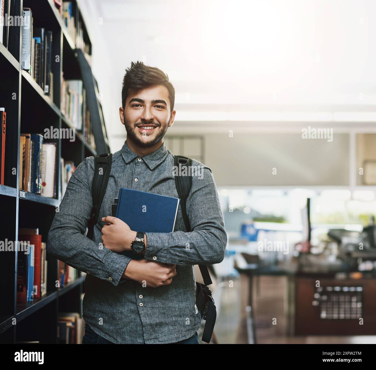 College, library and portrait of man with books for higher education ...
