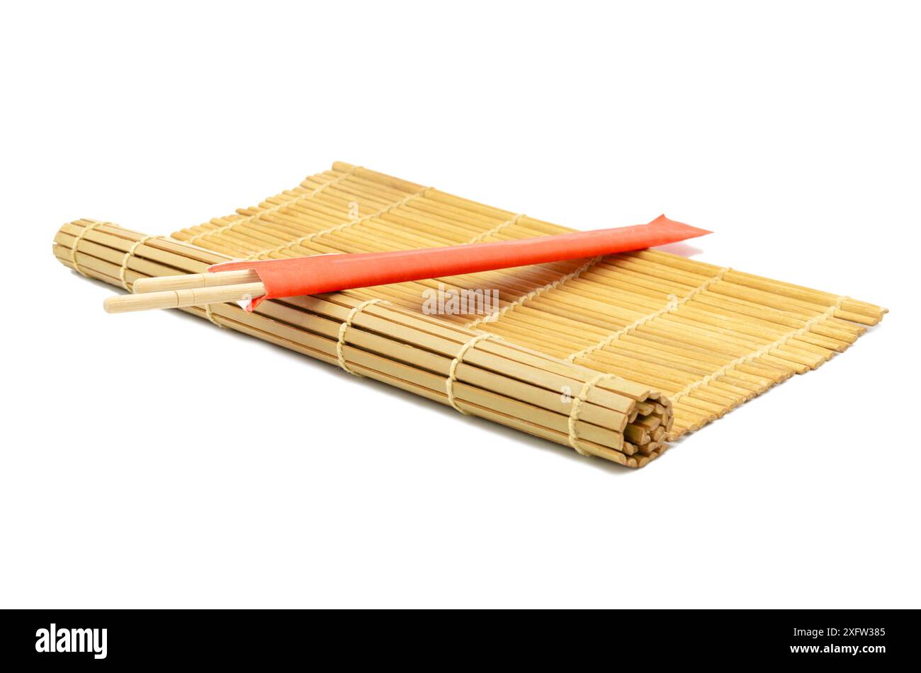 Sushi mat foldered and chopsticks near isolated on white background ...