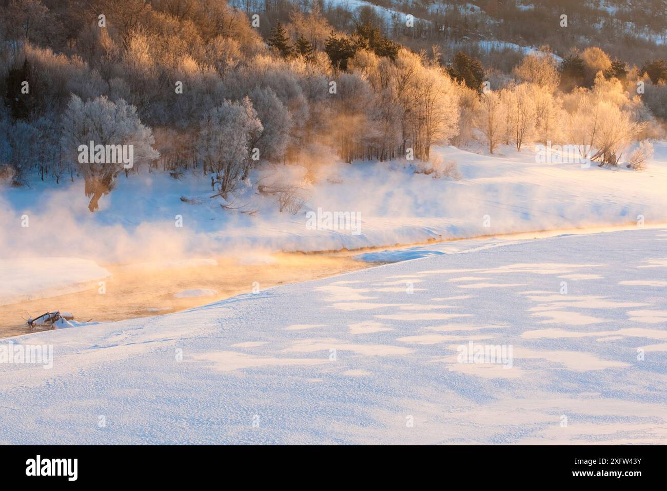 Steam rising from stream on frosty winter morning in the Abruzzo ...