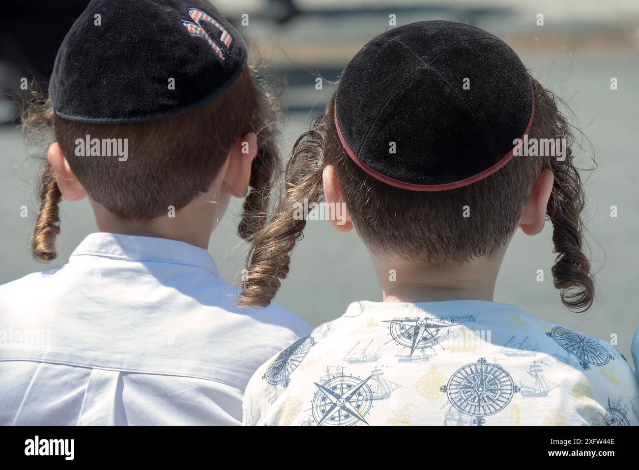Anonymous Jewish boys with long curly peyus & skullcaps. At a 2024 lag ...