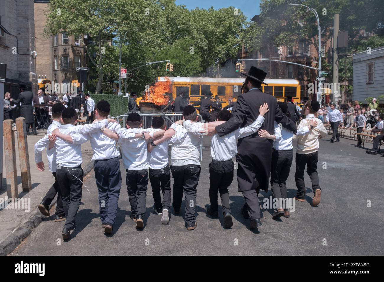 During Lag Bomer 2024 celebrations, a rabbi & his students line dance towards the traditional ...